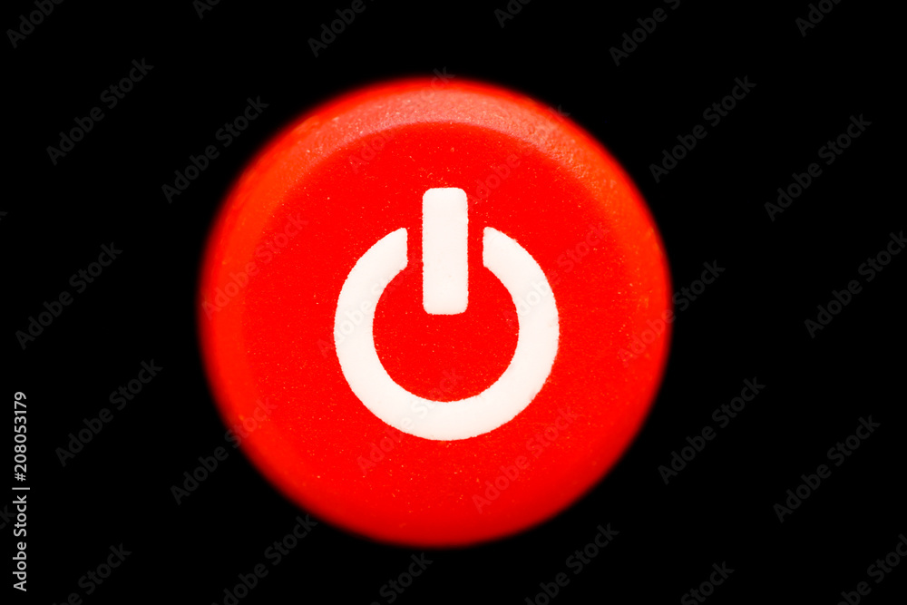 Round bright red power (on and off) button or switch with white power ...