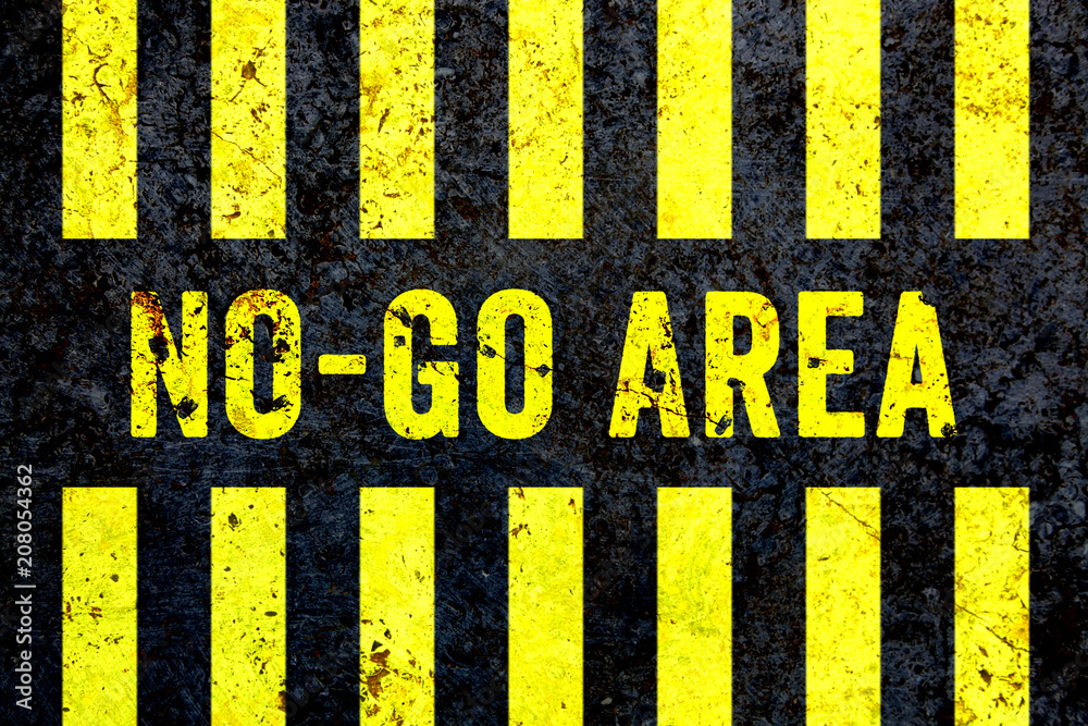 “No-Go Area” warning sign in yellow letters painted on grungy concrete ...