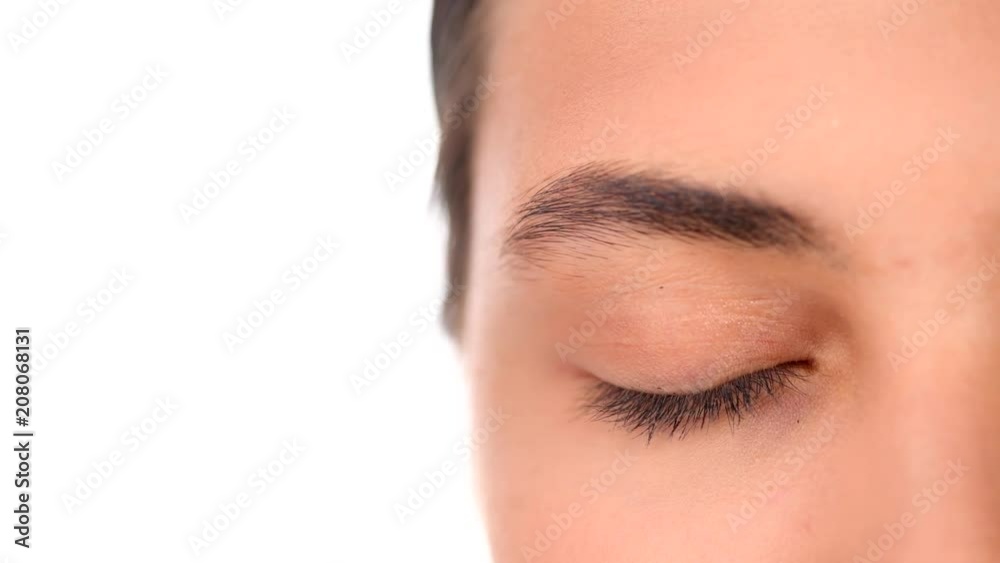 Beautiful female blue eye closeup. Young woman eye blinking over white ...