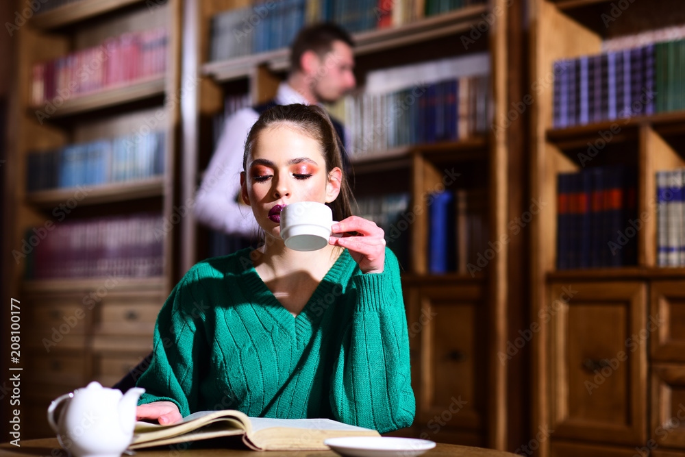 literature cafe with cute girl and man. woman in library read book at ...