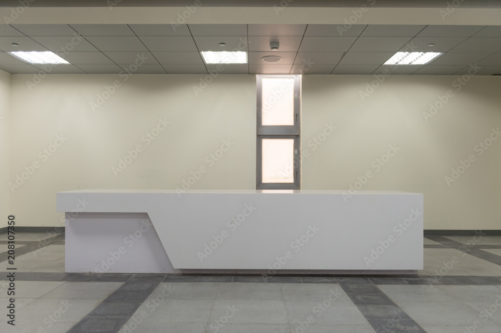 Reception desk in a corridor with large panoramic window with wide ...