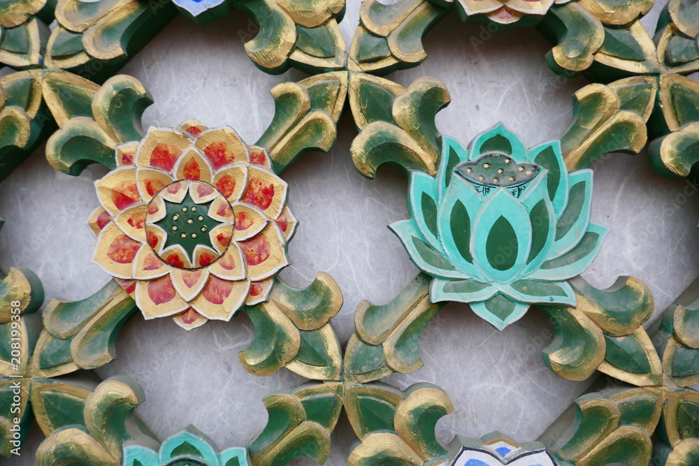 Detail of a door showing carved and painted lotus and hanji paper ...