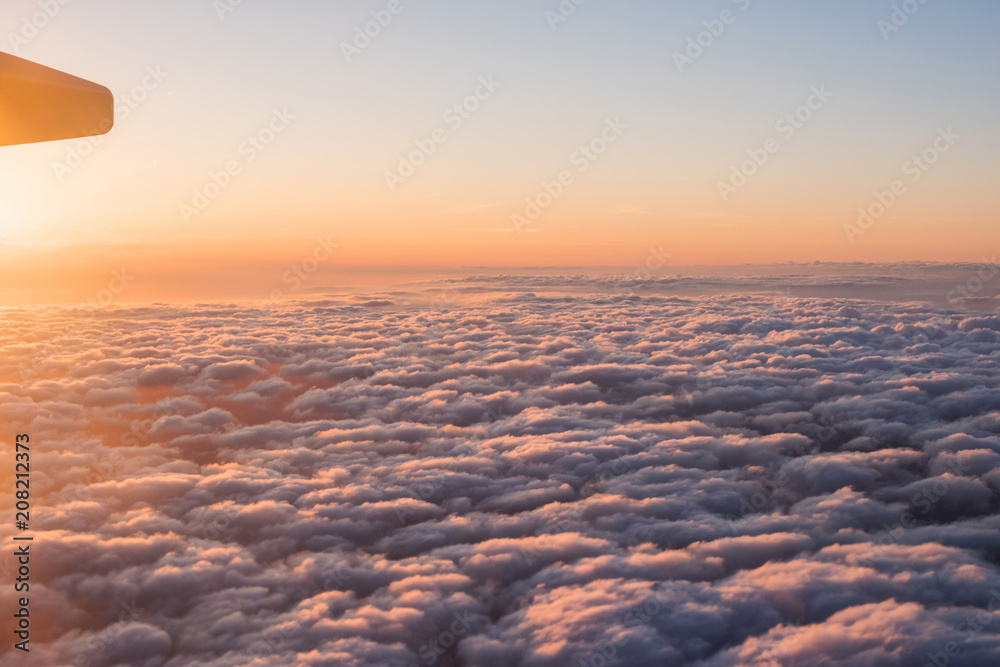 Evening sunset sky from the window of the airplane. View of the ...
