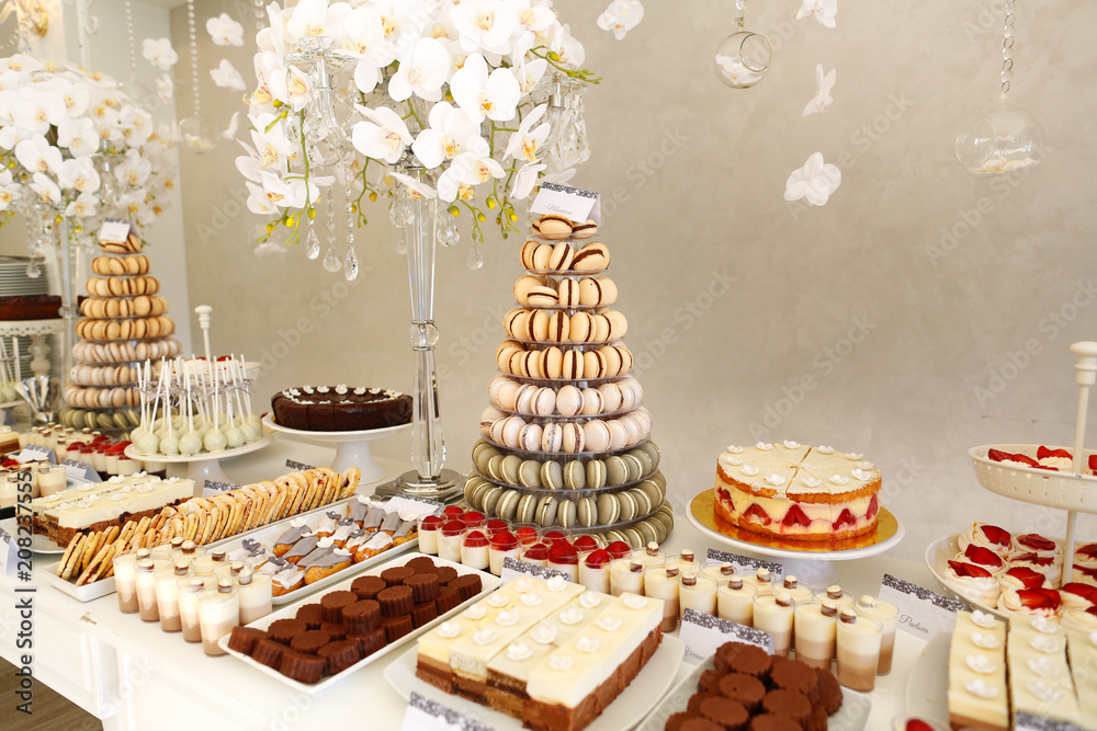 luxury wedding catering, table with modern desserts, cupcakes, sweets ...
