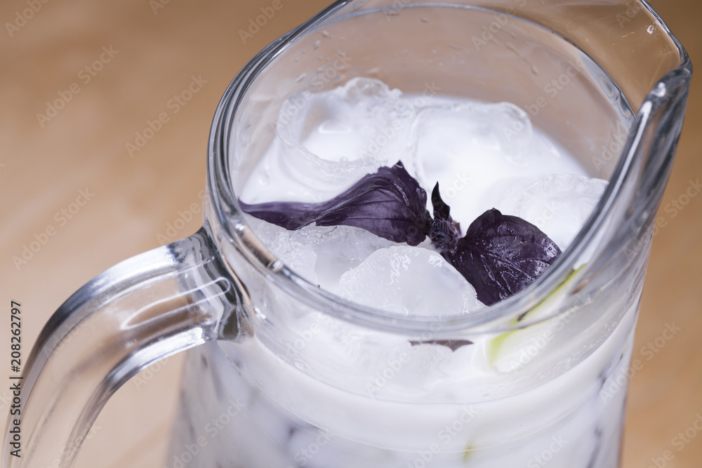 Ayran - liquid drink made from yogurt in ransparent glass cup and green ...