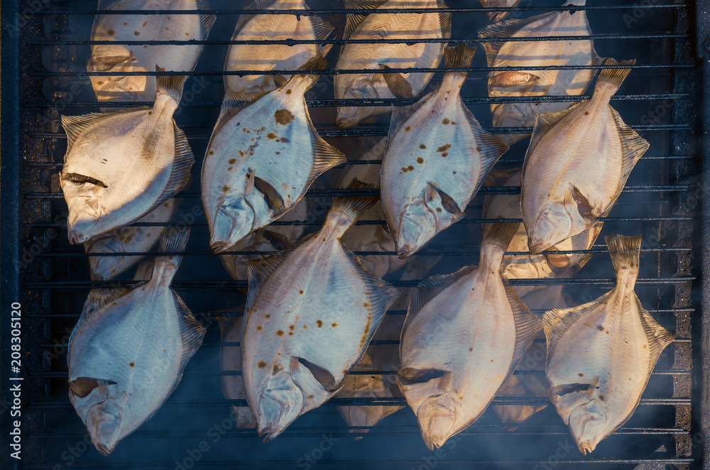 Fish Smoking Process. Smoked flounder. Close Up Smoking. Top view Stock ...