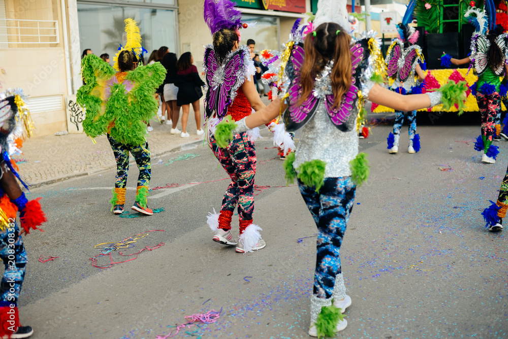 Unidentified blurry carnival dancer on street parade outdoors ...