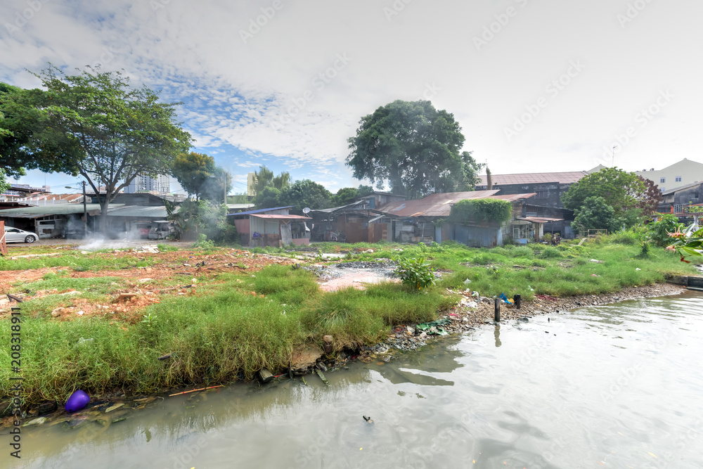 Close-up old shack slum house near Malacca river. Old wooden hut on ...
