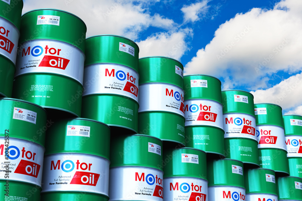 Group of stacked barrels with motor oil lubricant against blue sky ...