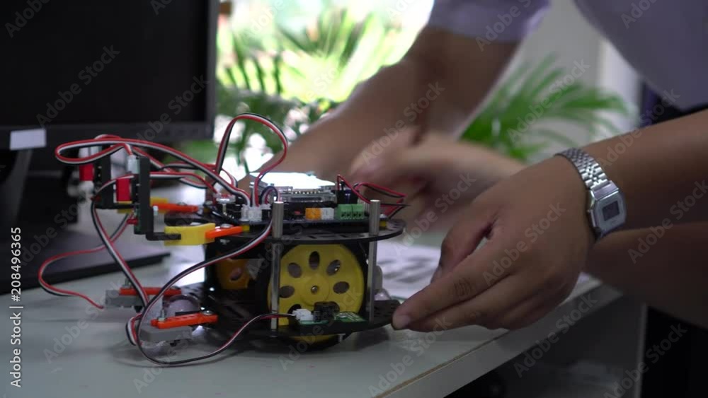 Learning STEM Education robotics project concept: Asian Student group ...