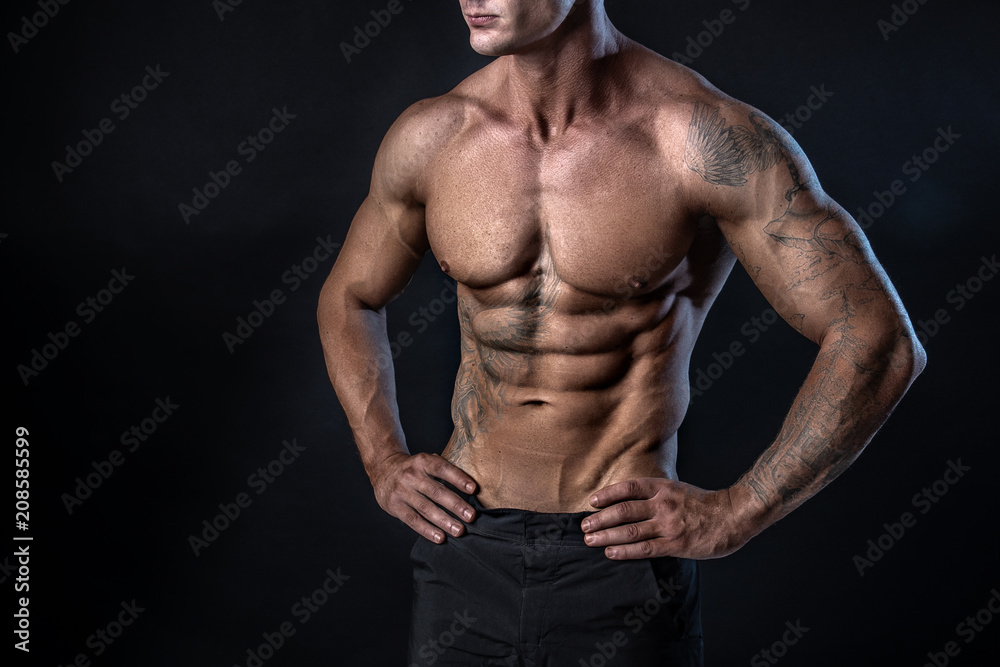Unrecognizable Strong bodybuilder with six pack. Bodybuilder man with ...