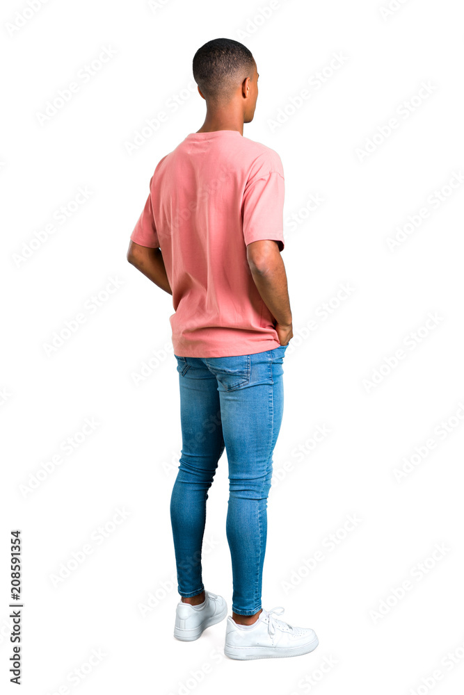 Standing young african american man looking back on isolated white ...