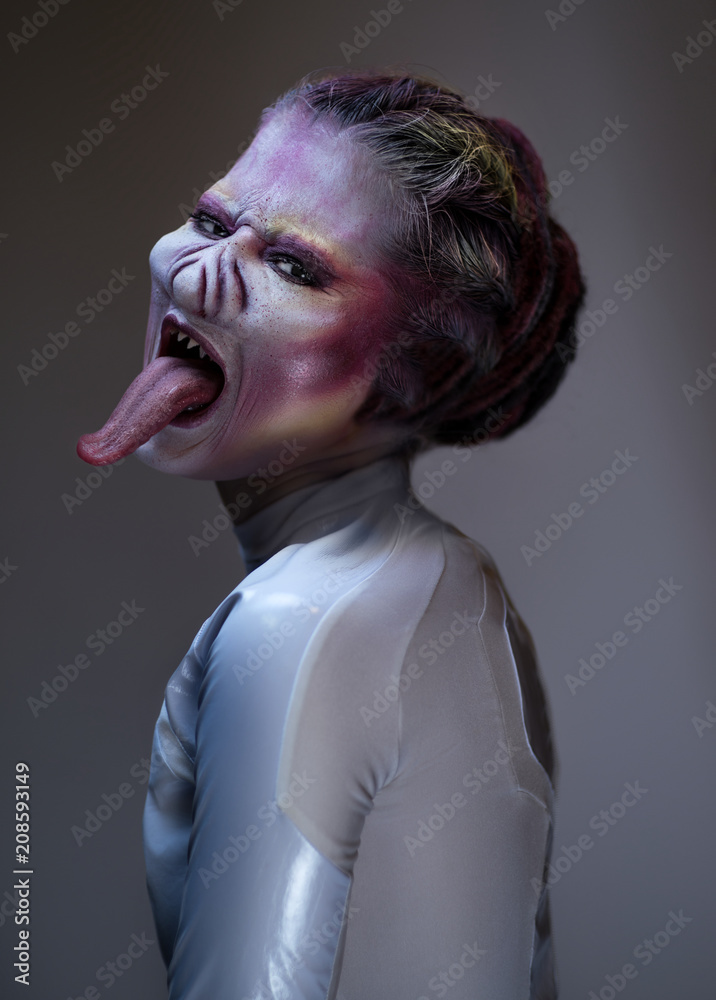 Portrait of female alien monster showing tongue Stock Photo | Adobe Stock