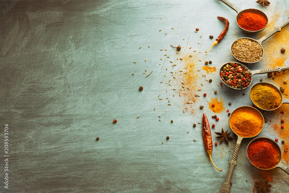 Wooden table of colorful spices. Stock Photo | Adobe Stock
