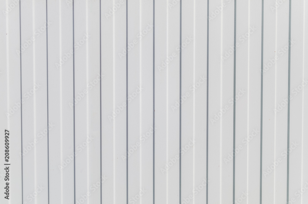 White background with horizontal stripes. White metal fence with ...