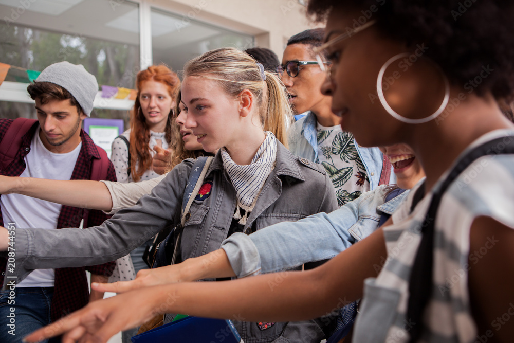 Students checking information board on campus Stock Photo | Adobe Stock