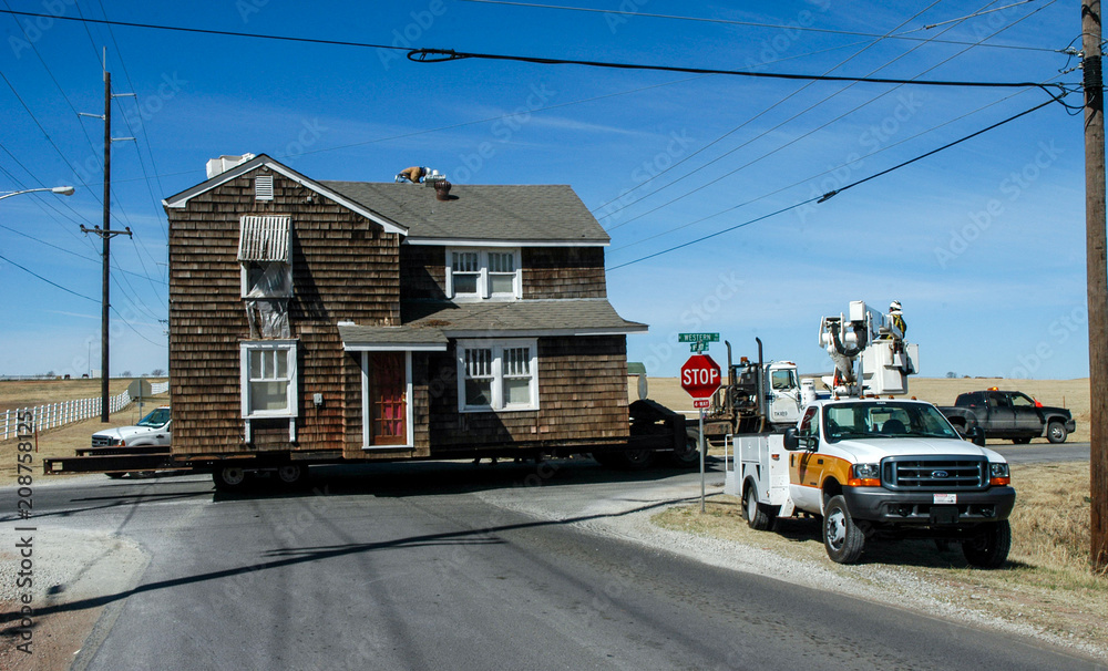 Oversize load - structural house mover with two-storey home on highway ...