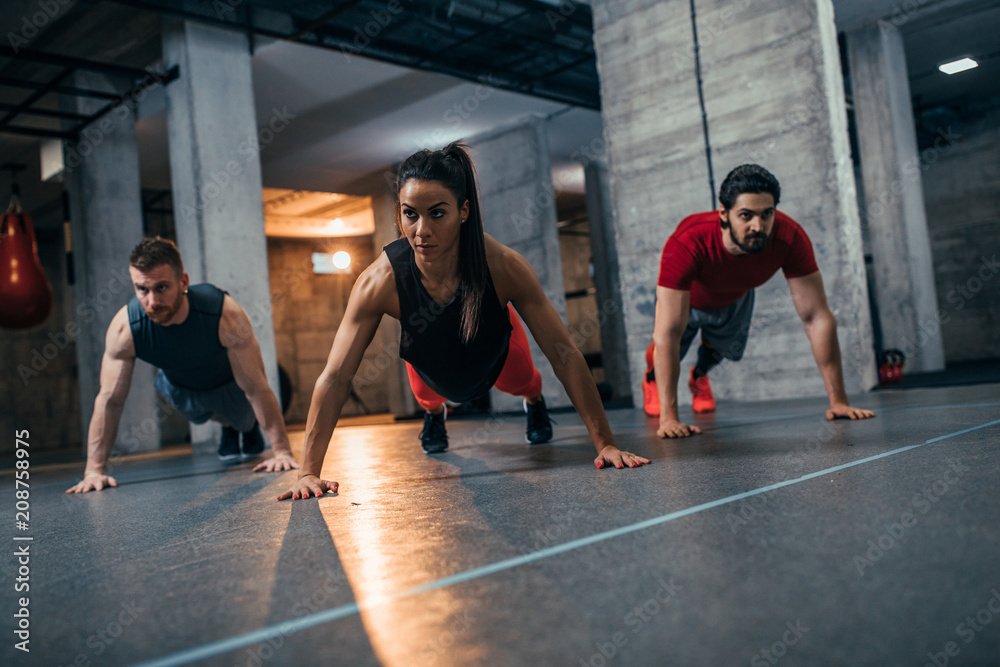 Working their core muscles to the max Stock Photo | Adobe Stock