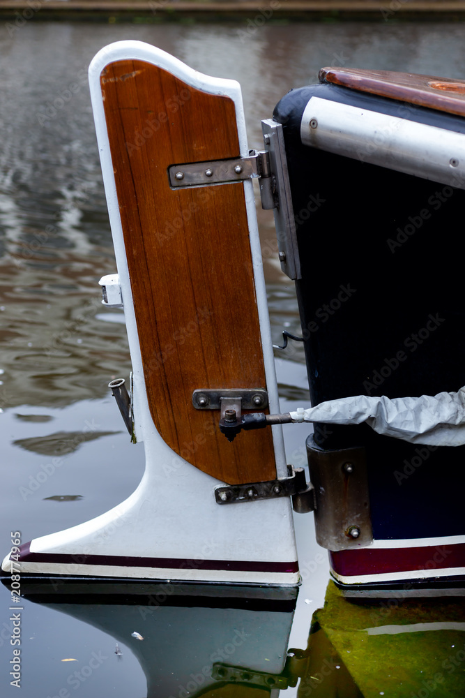 Image of the rudder of the blue canal boat Stock Photo | Adobe Stock