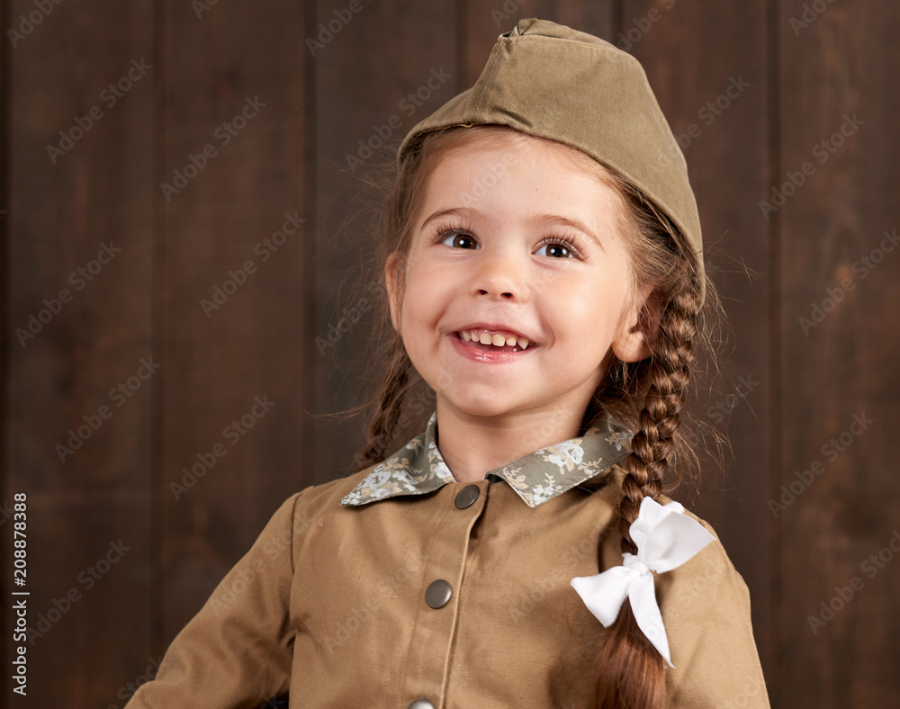child girl are dressed as soldier in retro military uniforms Stock ...