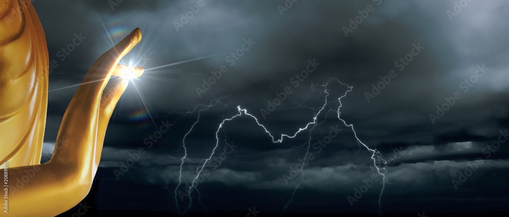 Buddha Hand on Thunderstorms and lightning background. It represents ...