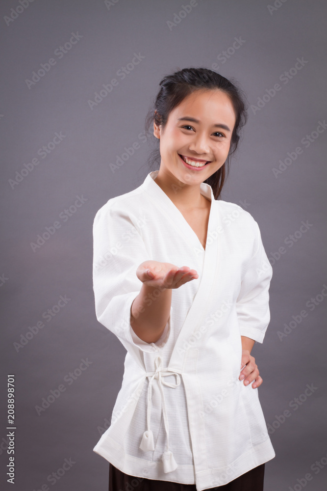 Fotografia do Stock: woman spa therapist pointing at you; asian woman ...