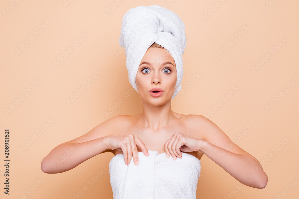 Portrait of unexpected shocked wondered model wrapped in towel with ...