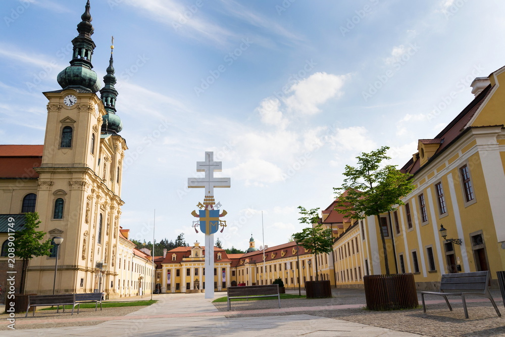 Papal coat of arms on cross in front of the Pilgrimage Basilica of the ...