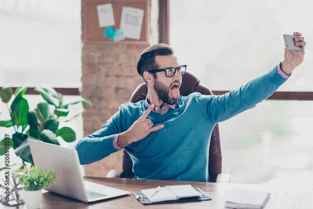 Attractive, funky, stylish, professional manager showing rock and roll ...