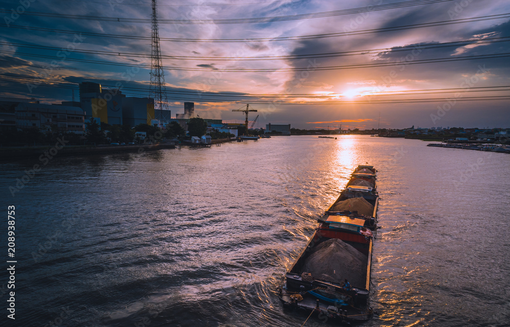 BANGKOK, THAILAND - 2018 JUNE 6: The tug boats towing a big barge with ...