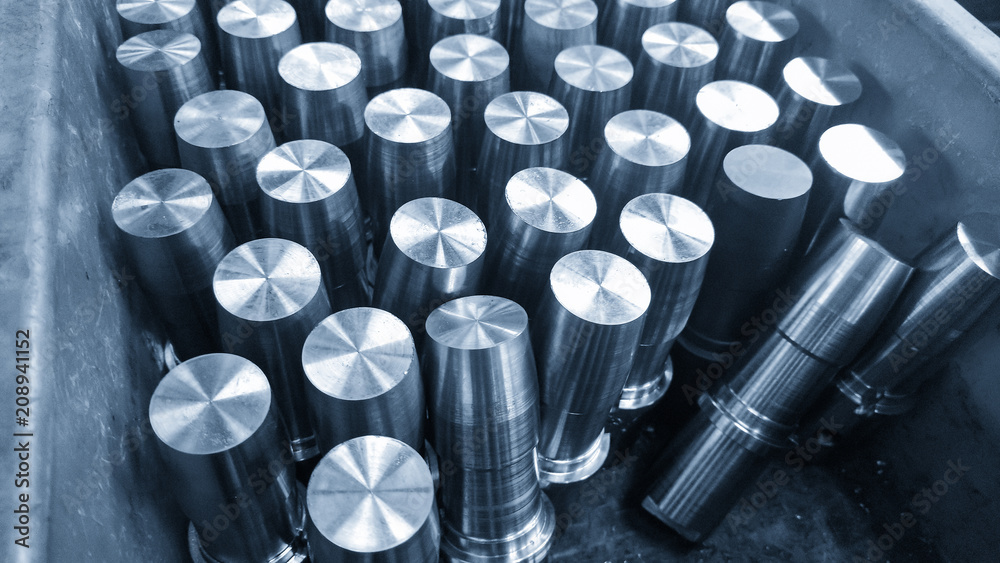 The stack of metal rod after turning process in the light blue scene ...