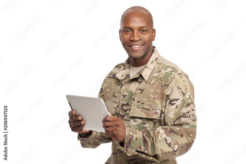 African American Soldier with Computer in Studio Smiling Stock Photo ...