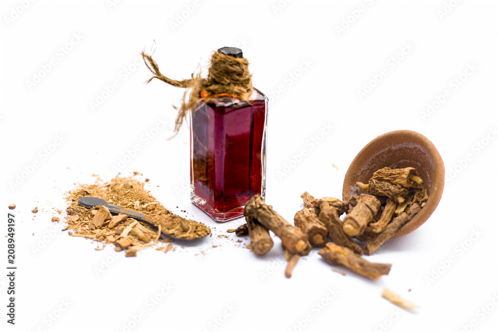 Dark red colored essence of nannari or Indian sarsaparilla in a ...