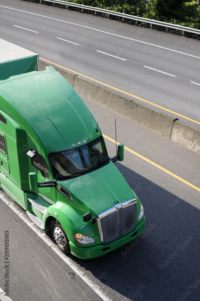 Green big rig semi truck for long haul cargo transporting dry van semi ...