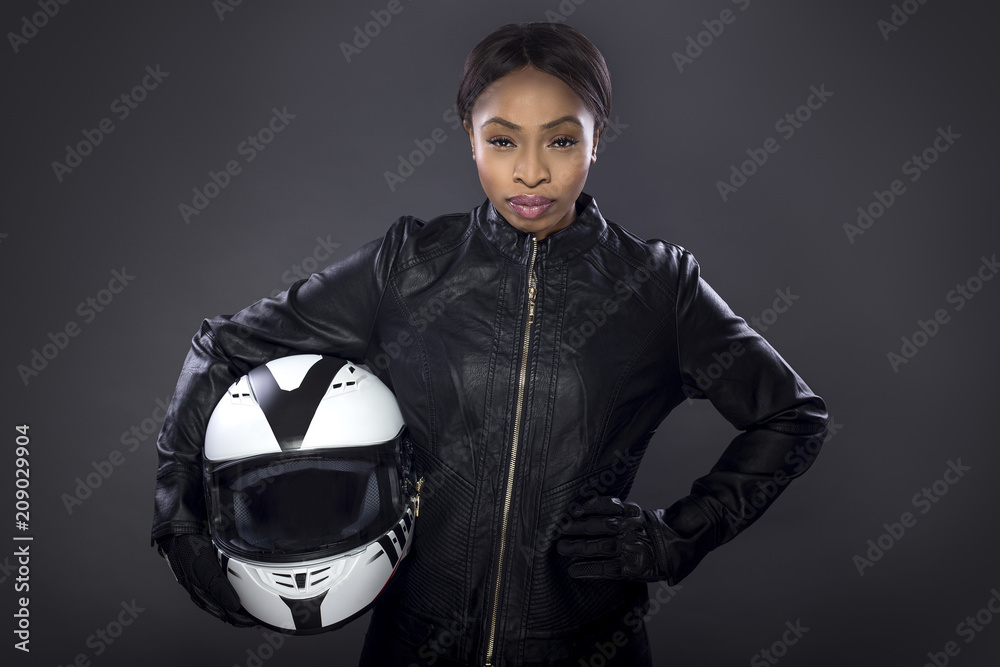 Black female motorcycle biker or race car driver or stuntwoman wearing ...