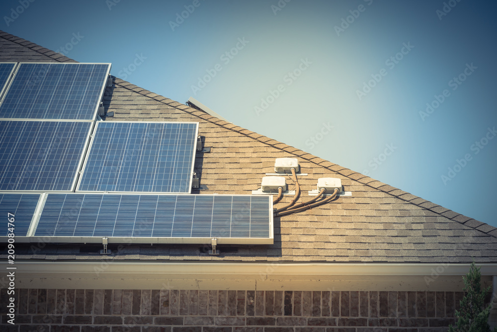 Solar panel system on asphalt shingles rooftop of commercial building ...