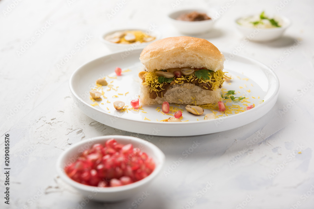 Dabeli is an Indian snack item served with Pomegranate Seeds and ...