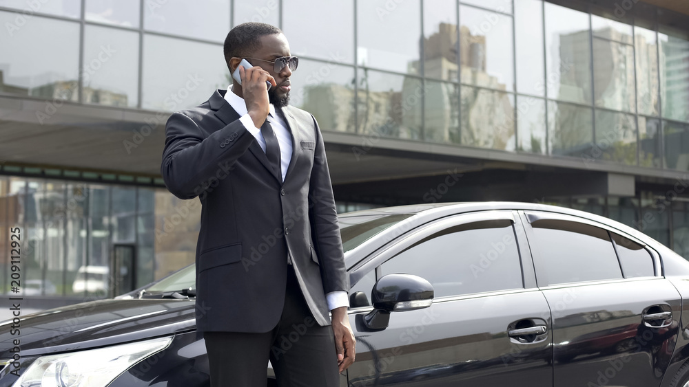 Detective of secret service receiving instructions by phone, security ...