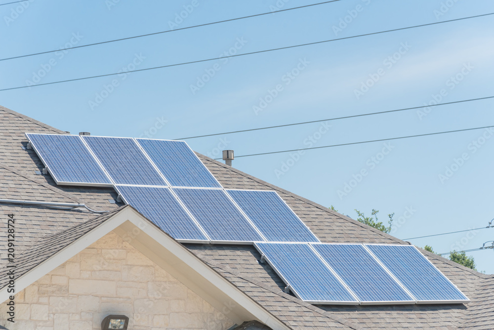 Concept of renewable clean vs. traditional energy. Close-up solar panel ...