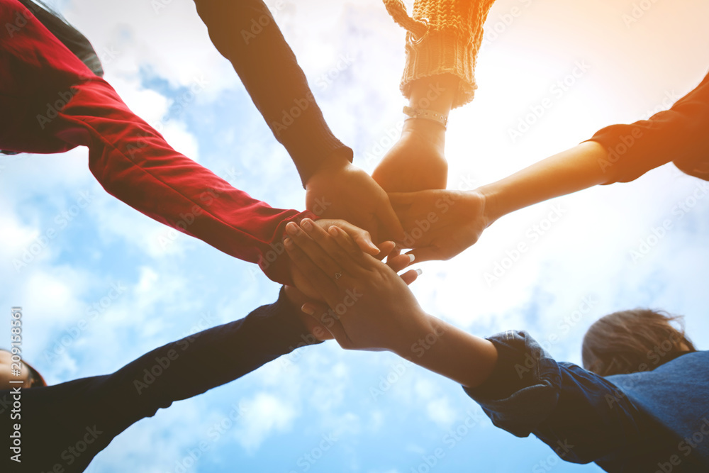 Group hands unity with their hands together ,concept successful ...