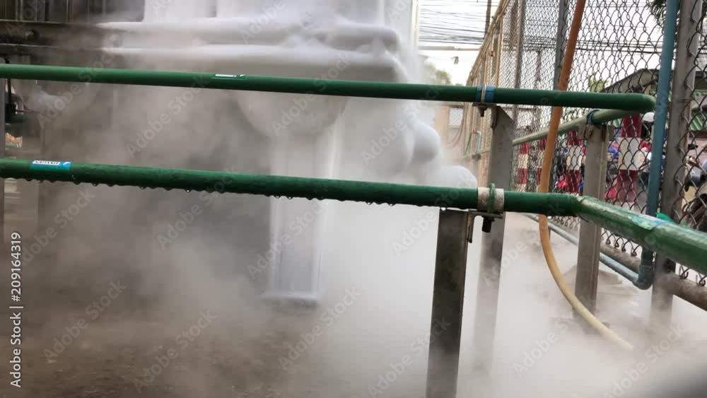 Close up of container with liquid nitrogen,Cold metal pipe smoking from ...