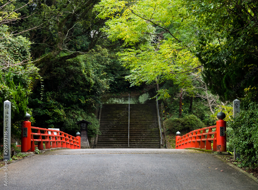 Red Japanese bridge and steps in the park of Kitsuki castle - Kitsuki ...