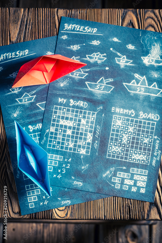 Battleship paper game ready to play and red ship Stock Photo | Adobe Stock