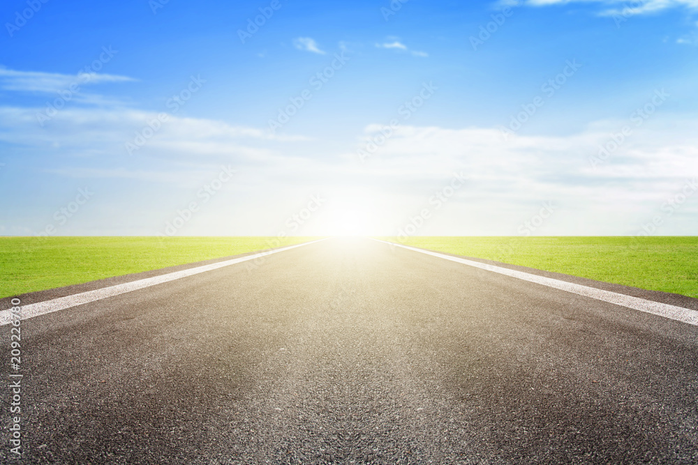 Asphalt road and blue sky background Stock Photo | Adobe Stock