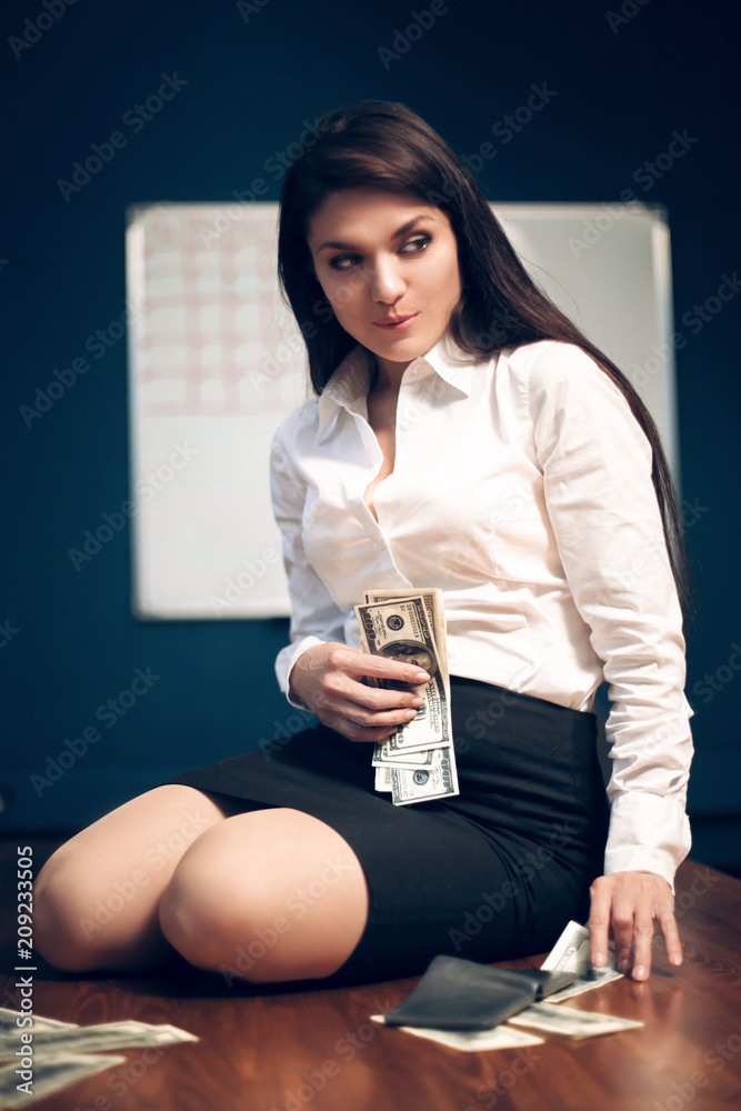 Pretty business woman holding couple of dollar bills. Gorgeous female ...