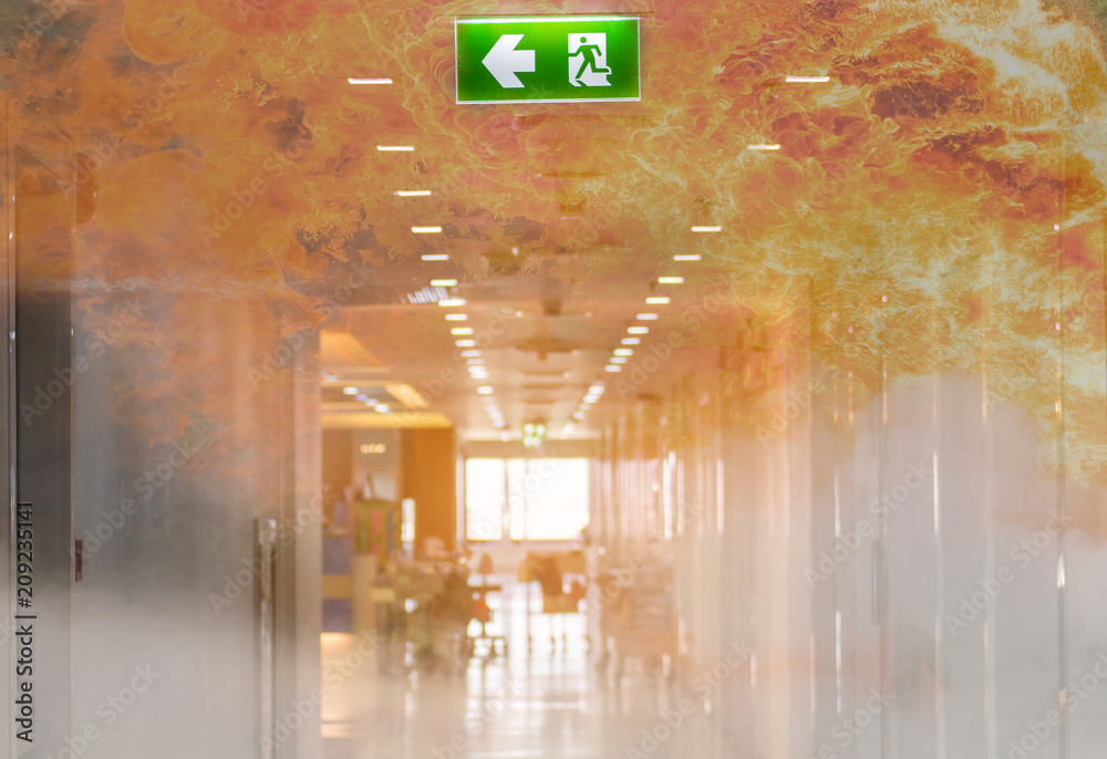 double exposure green emergency exit sign in hospital showing the way ...