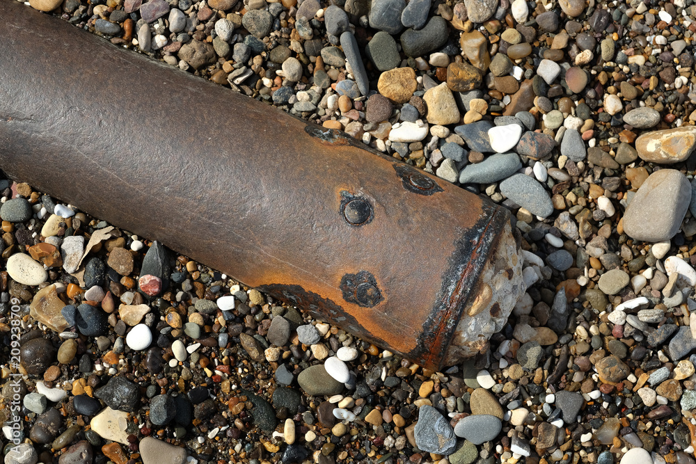 Parts of British world war two rp3 3 inch rocket projectile on a beach ...