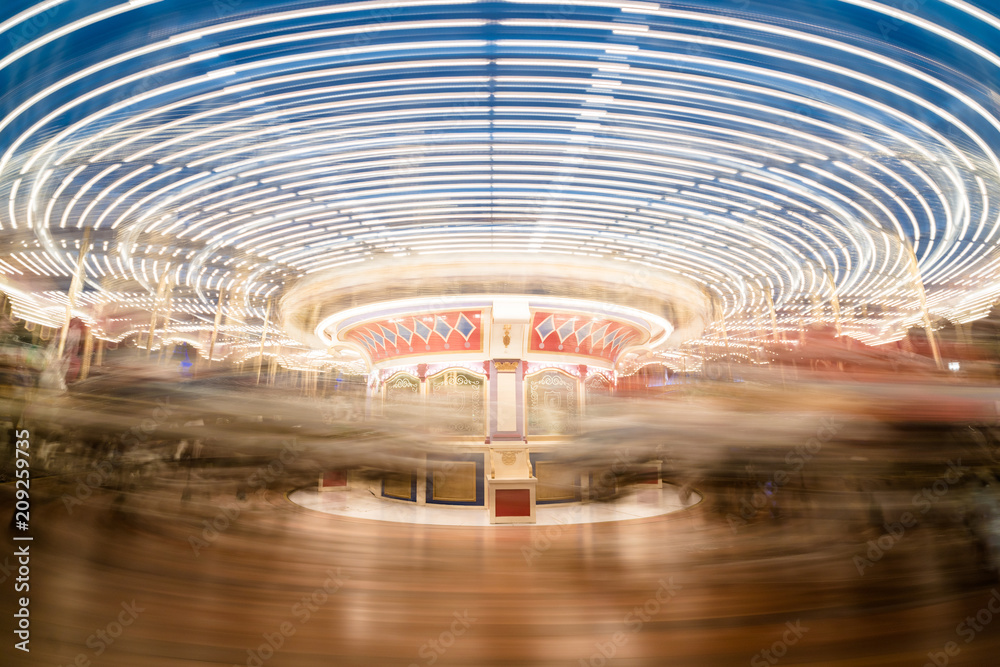 Long exposure beautiful spinning bright merry-go-round Carousel at ...