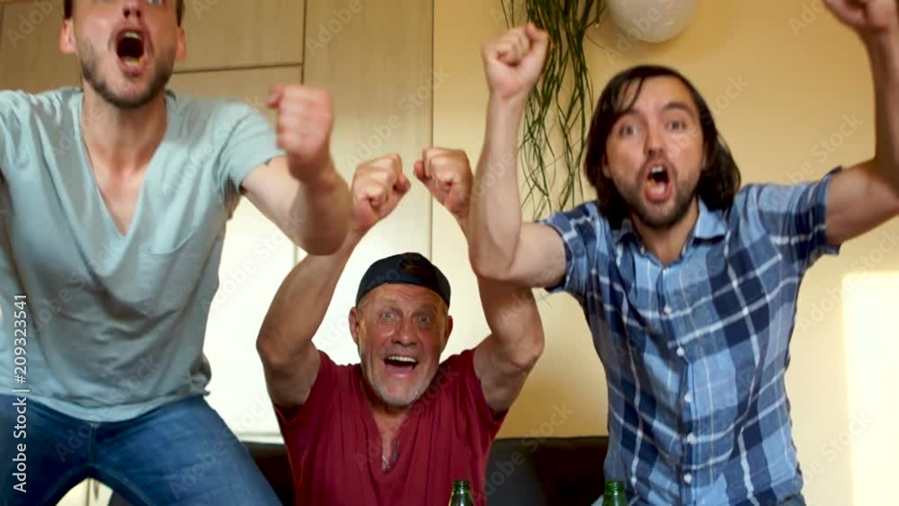 Two generations of men, three football fans are rooting for their ...