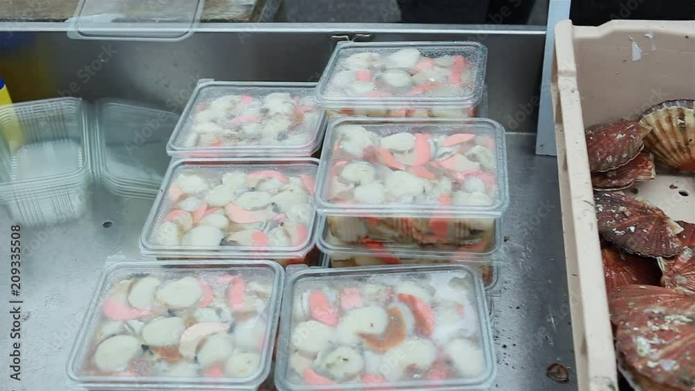 Fresh scallops at the fish market in Normandy, France. Traditional ...
